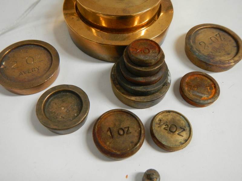 A collection of various brass weights