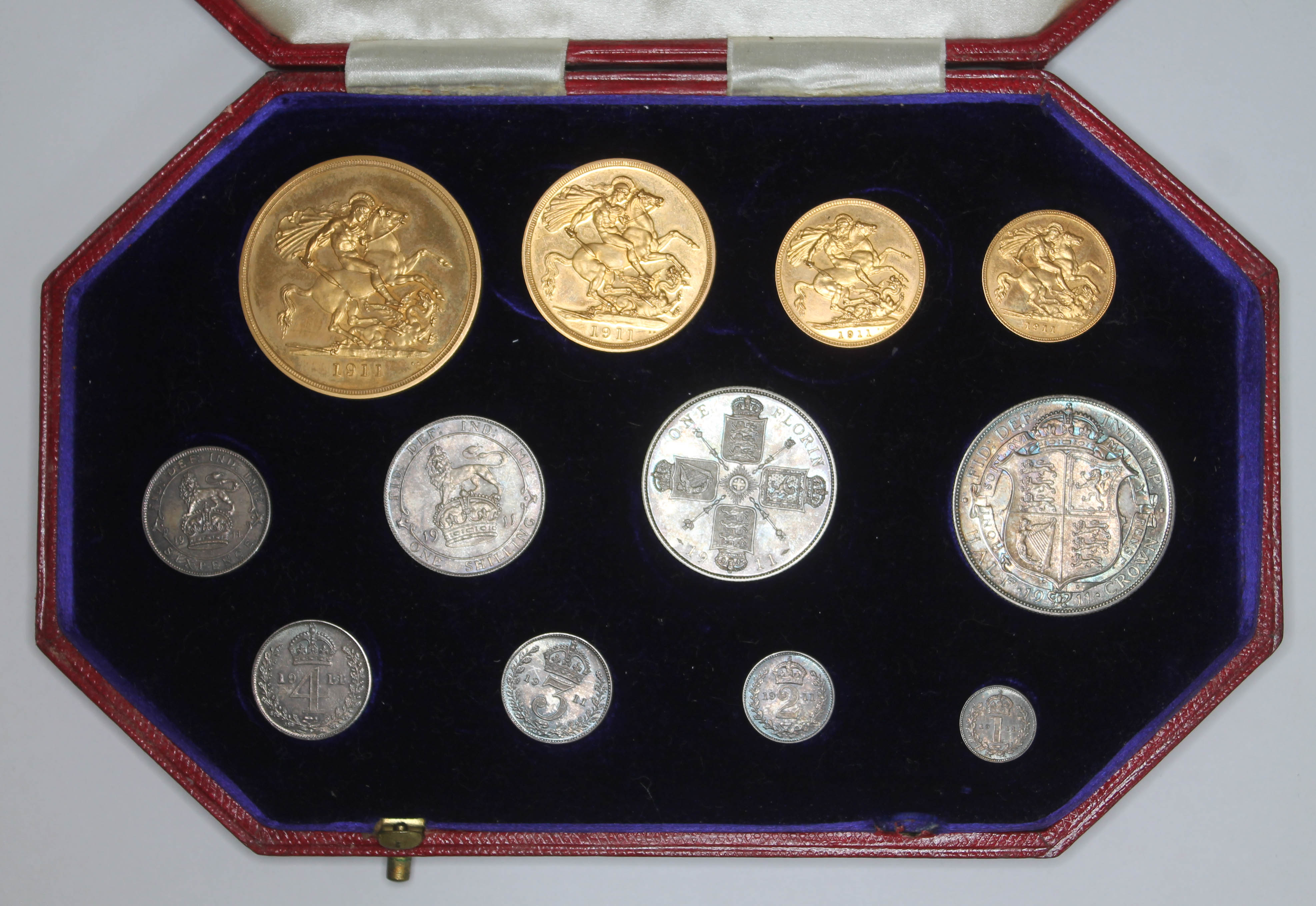 A George V 1911 proof specimen long set comprising five pounds, two ...