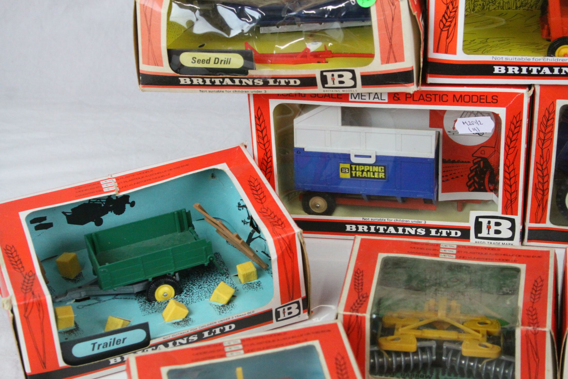 19 boxed 1:32 scale diecast Britains farm implements,to include nos ...
