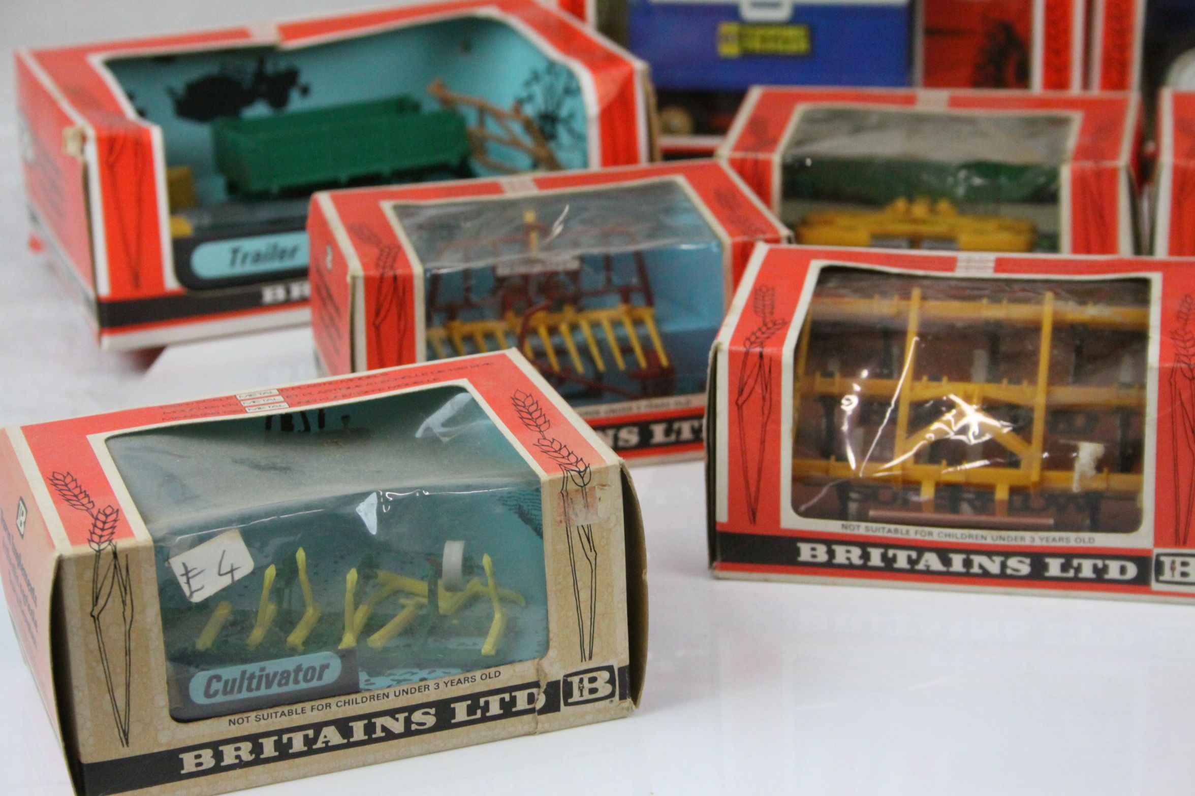 19 boxed 1:32 scale diecast Britains farm implements,to include nos ...