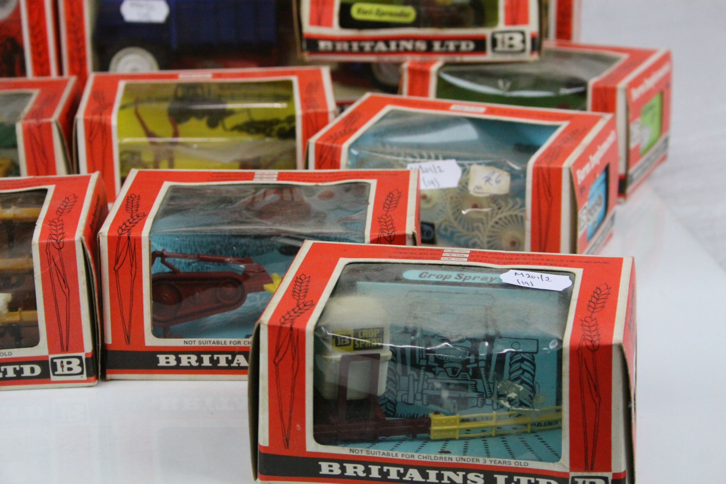 19 boxed 1:32 scale diecast Britains farm implements,to include nos ...