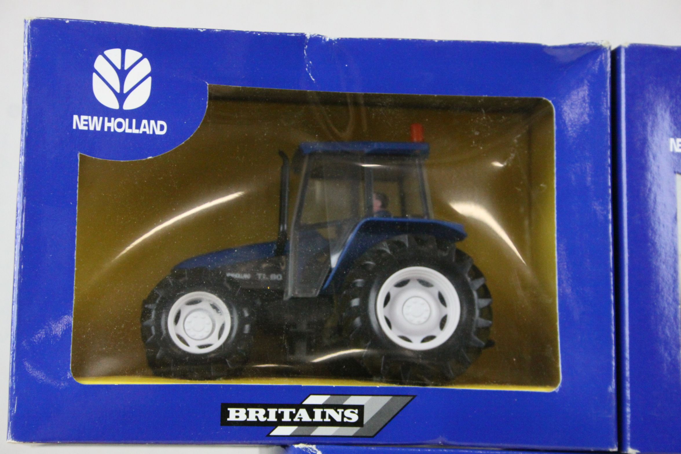 Eight boxed Britains 1:32 scale diecast tractors and other commercial ...