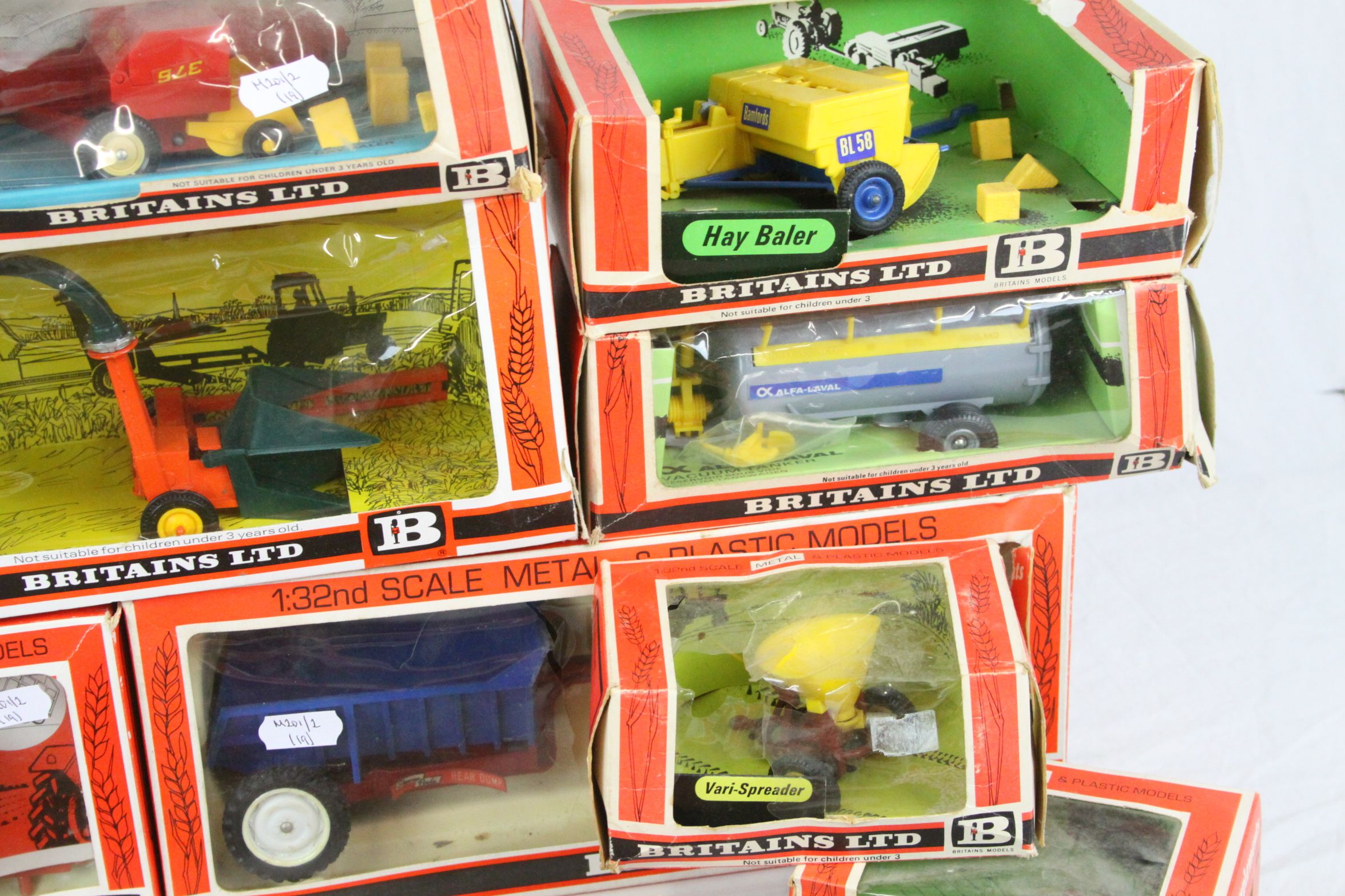 19 boxed 1:32 scale diecast Britains farm implements,to include nos ...