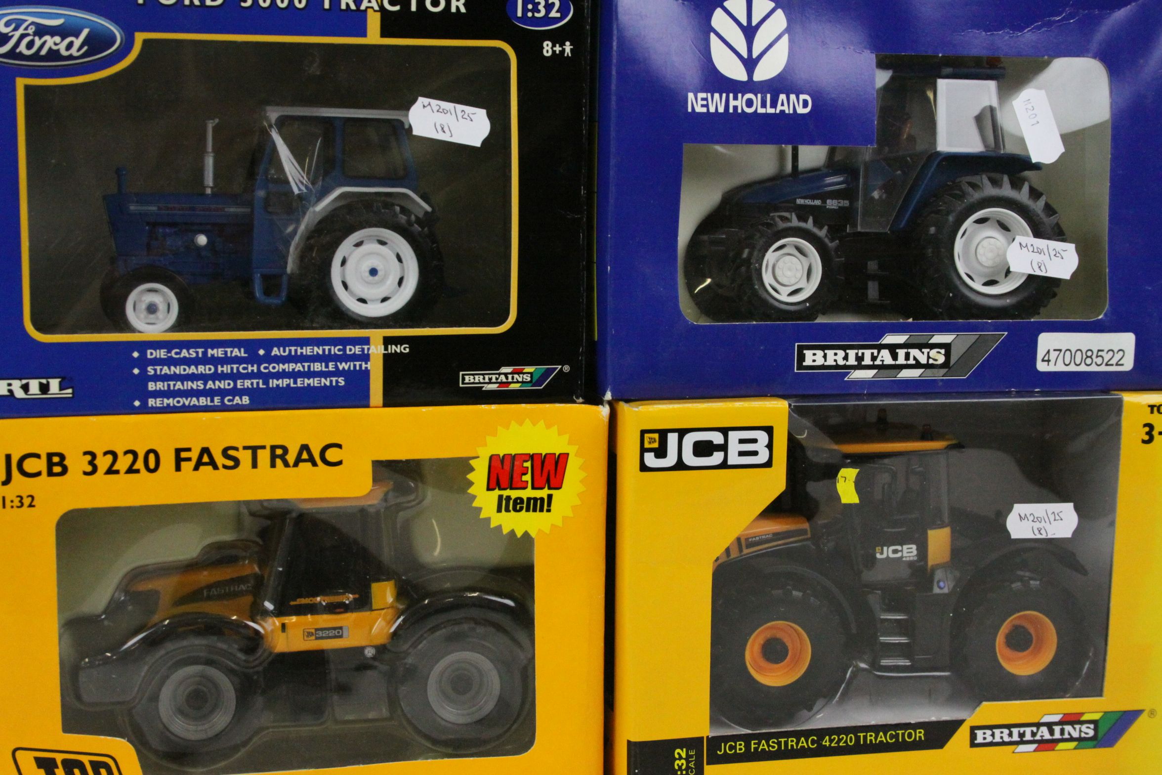 Eight boxed Britains 1:32 scale diecast tractors and other commercial ...