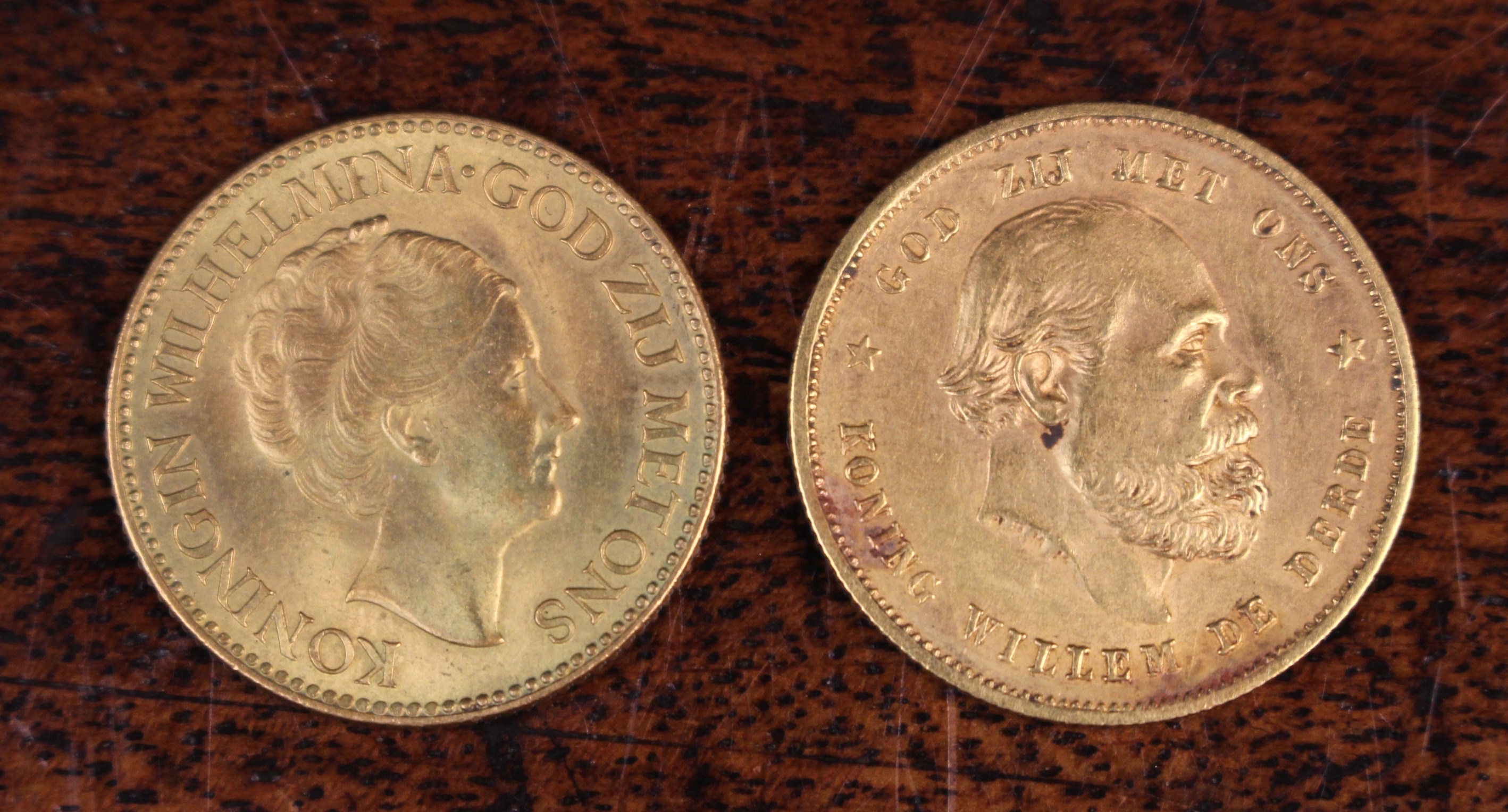 Two Dutch Gold 'Ten Gulden' Coins, one dated 1876 (6.729 g), the other ...