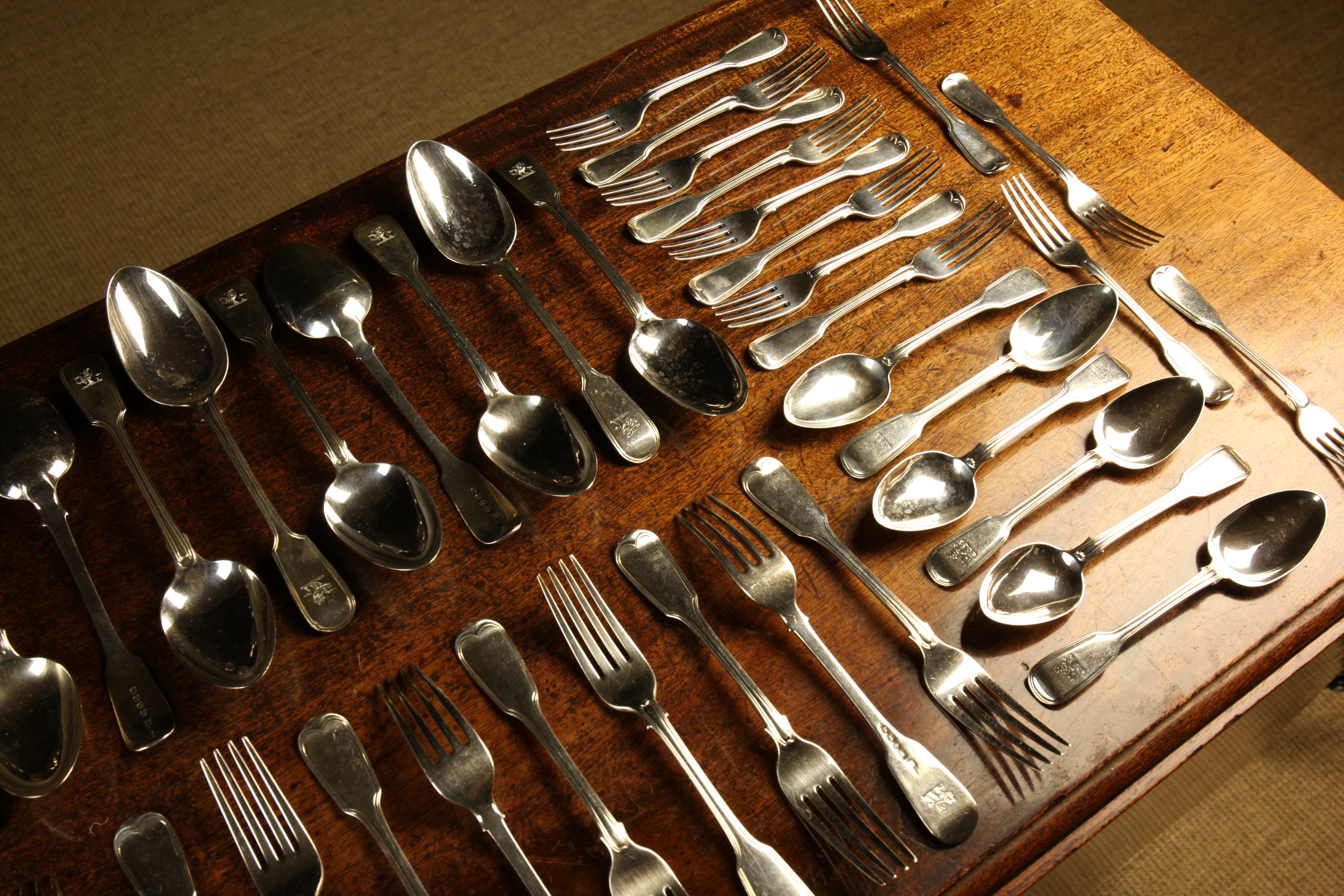 A Composite Set of Georgian Silver Flatware for twelve place settings ...