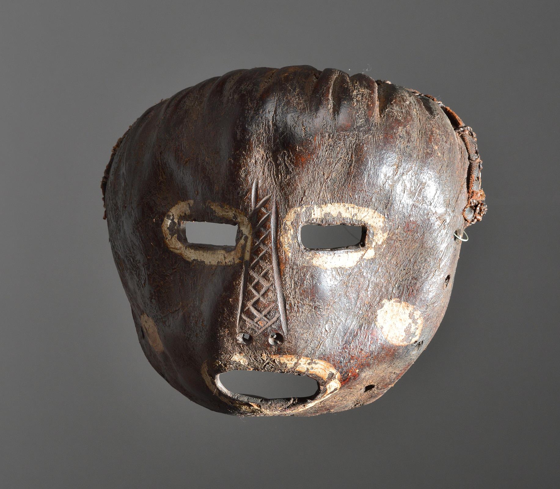 A Mbole mask Democratic Republic of the Congo leather with fibre and ...