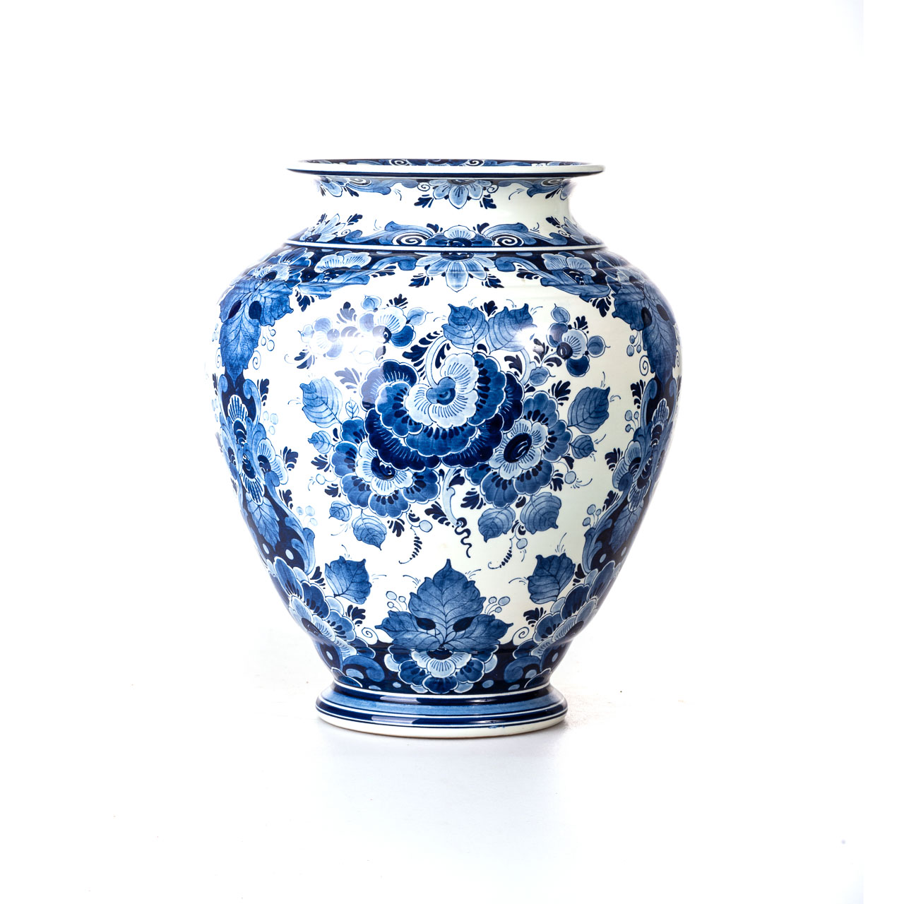 A BLUE AND WHITE 'REGINA' DELFT BLAUW VASE With floral and leaf motif ...