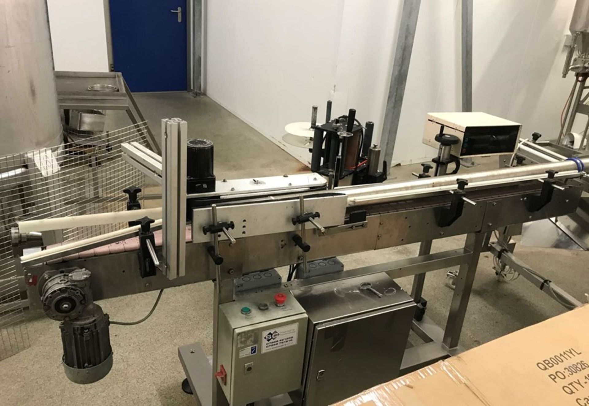 1 x NN C-wrap labeller. Single speed conveyor belt with guard. Located ...