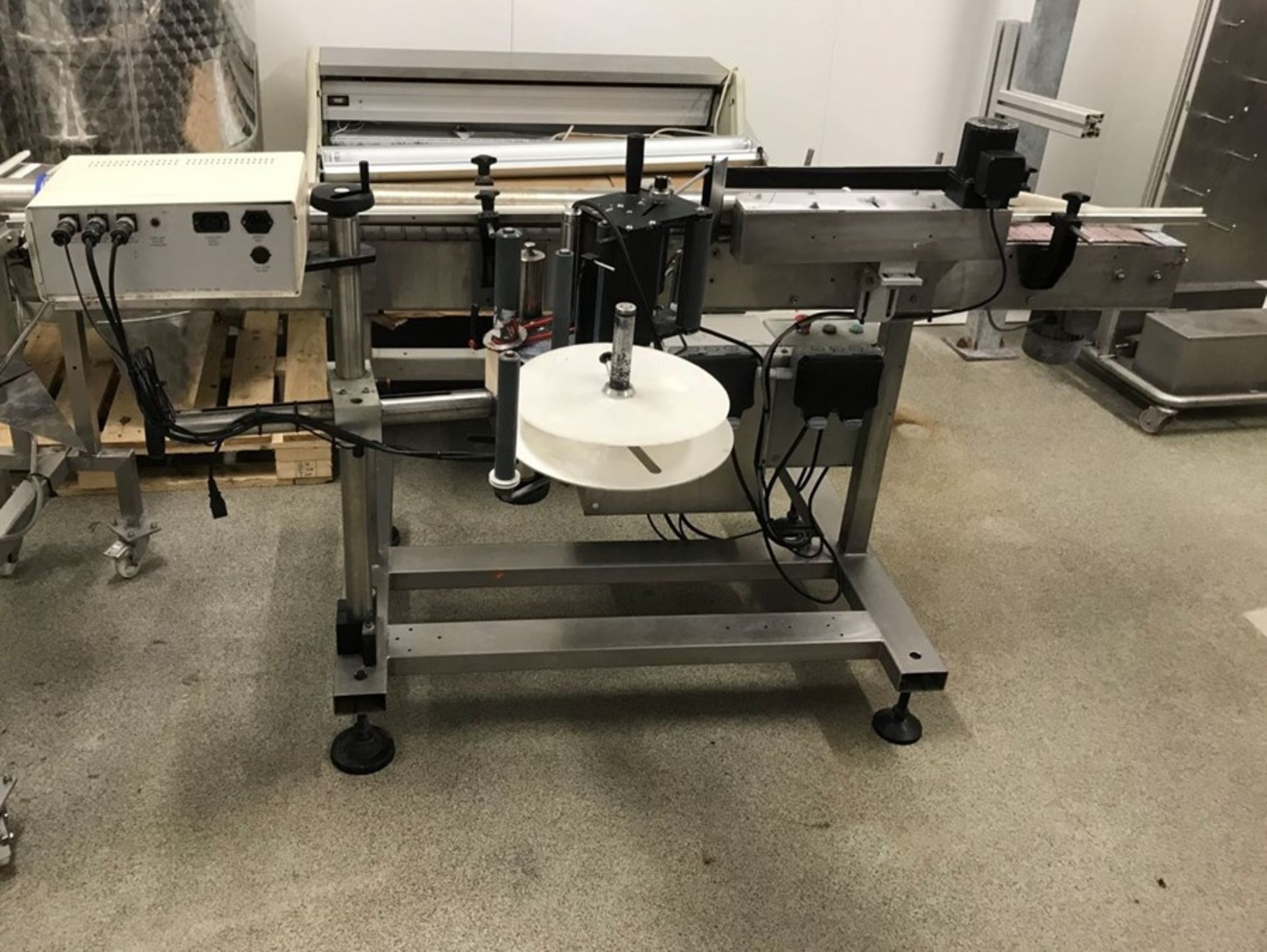 1 x NN C-wrap labeller. Single speed conveyor belt with guard. Located ...