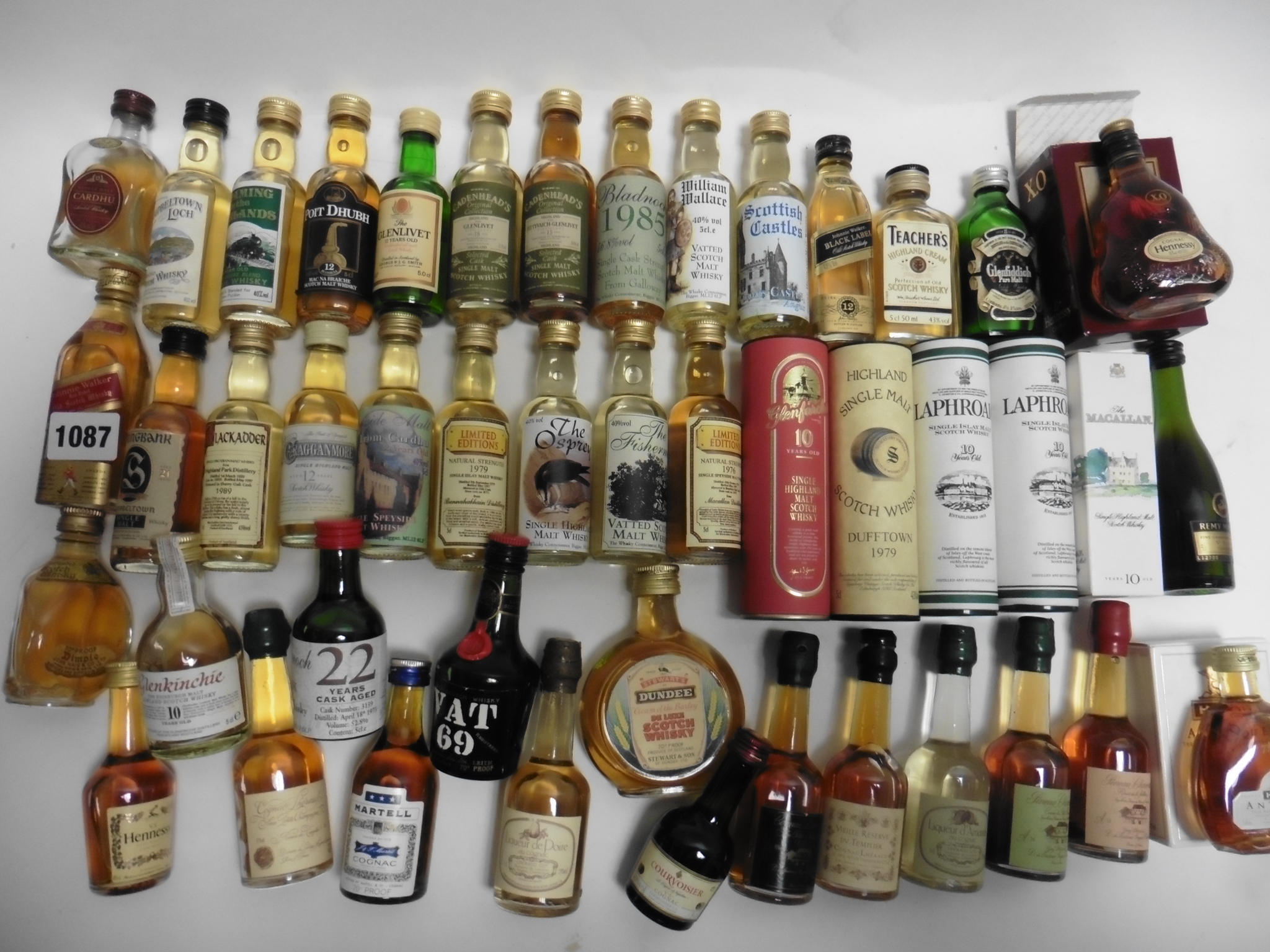 A collection of 32 various Whisky miniatures and 12 Cognac miniatures ...