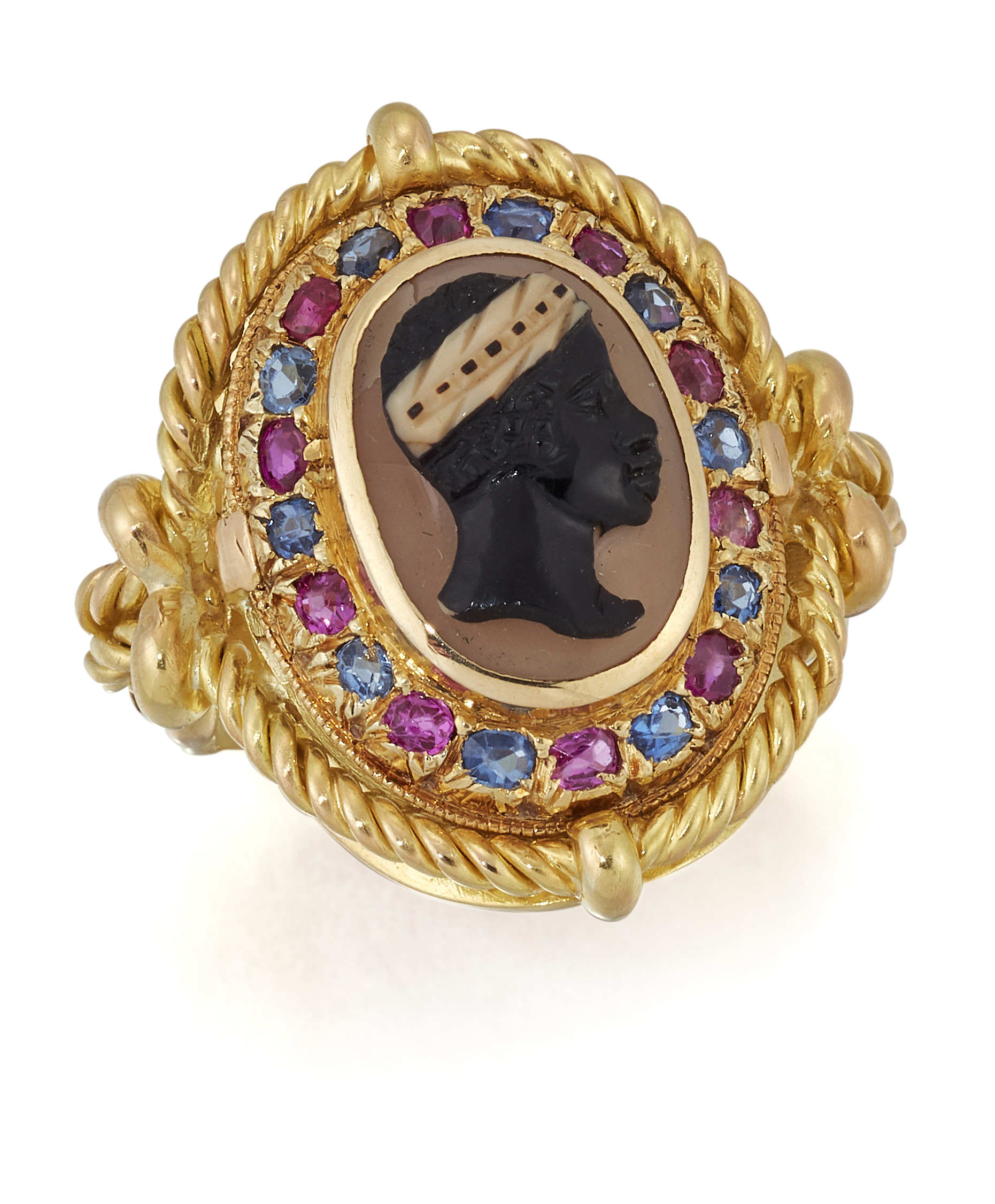 A SARDONYX CAMEO, RUBY AND SAPPHIRE RING, an oval sardonyx carved with ...
