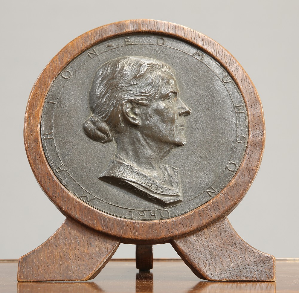 ROBERT THOMPSON OF KILBURN A RARE MOUSEMAN OAK FRAME WITH INSET BRONZE ...