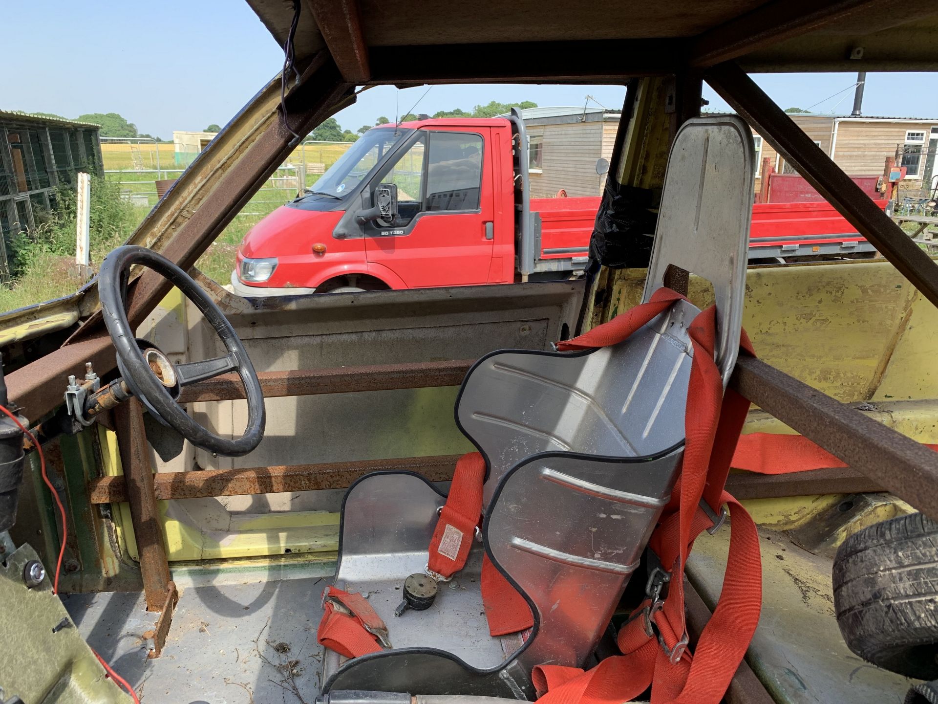 Reliant 3 wheel banger racing car with cage