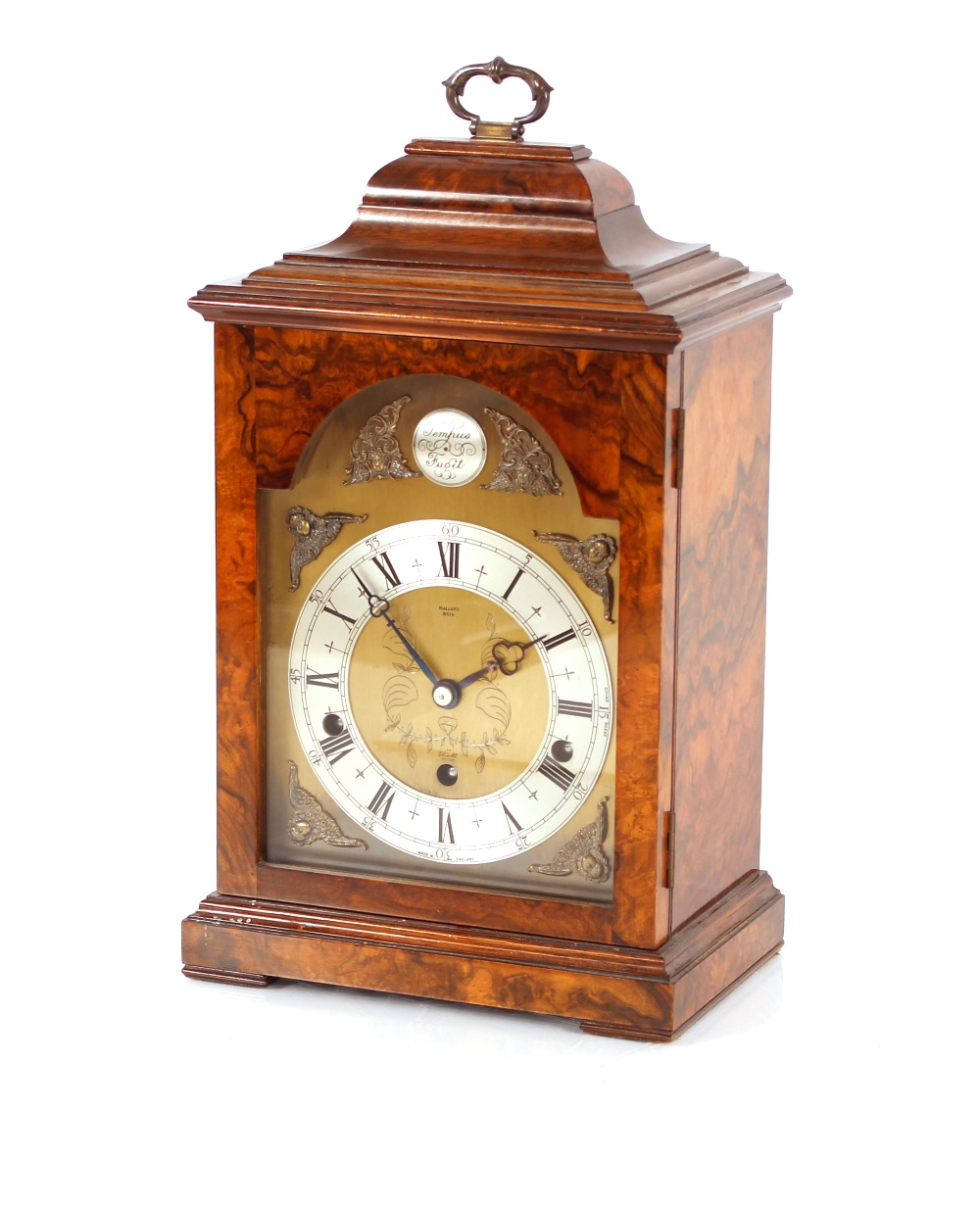 A burr walnut cased mantel clock, having chiming movement by Mallory of ...