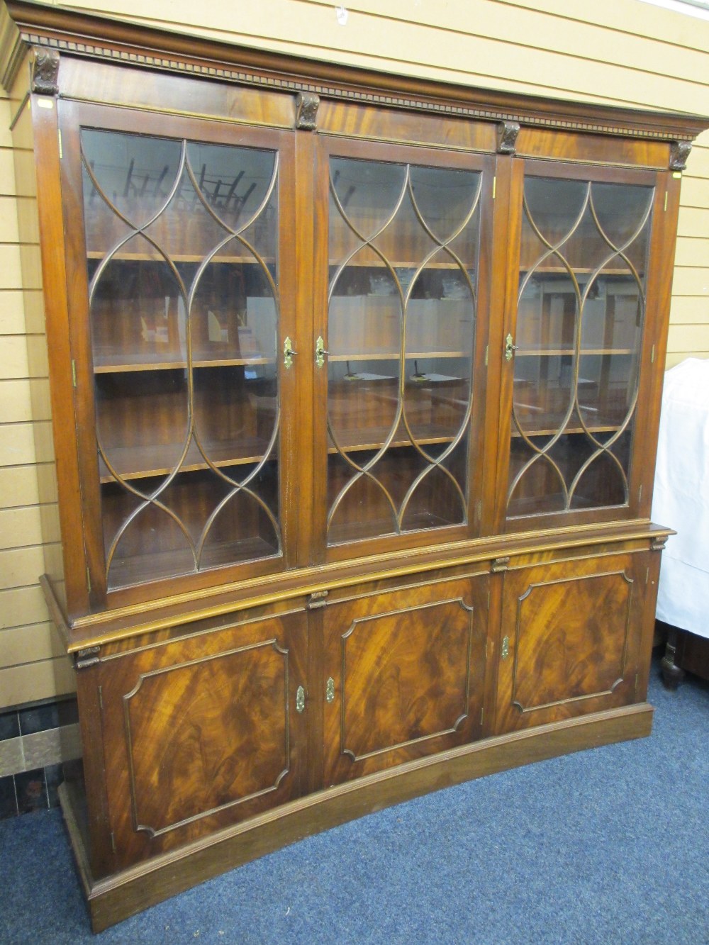 MAHOGANY CONCAVE REPRODUCTION BOOKCASE with dentil shaped cornice, over ...
