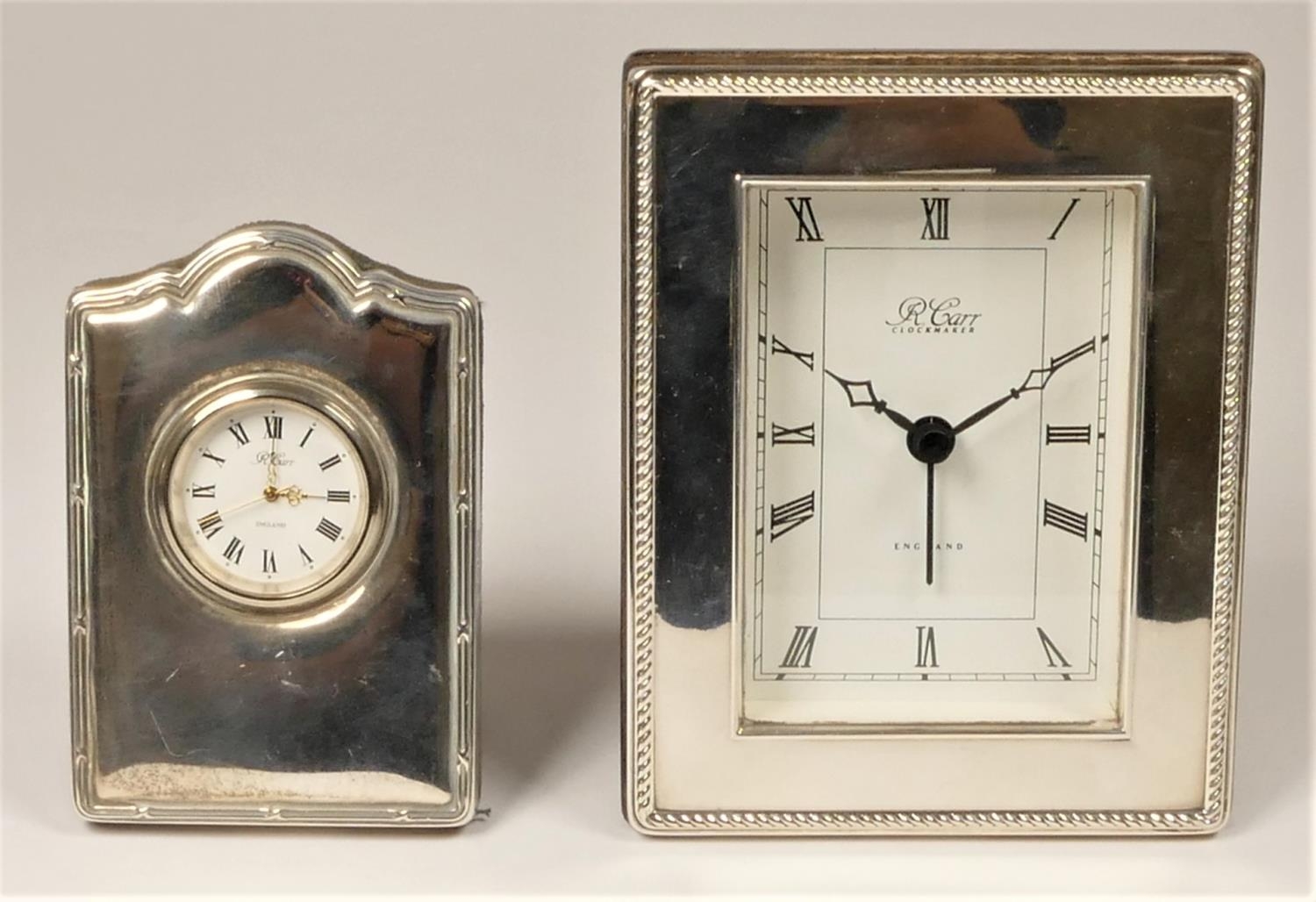 Two silver R.Carr Clockmaker, England, bedside clocks.