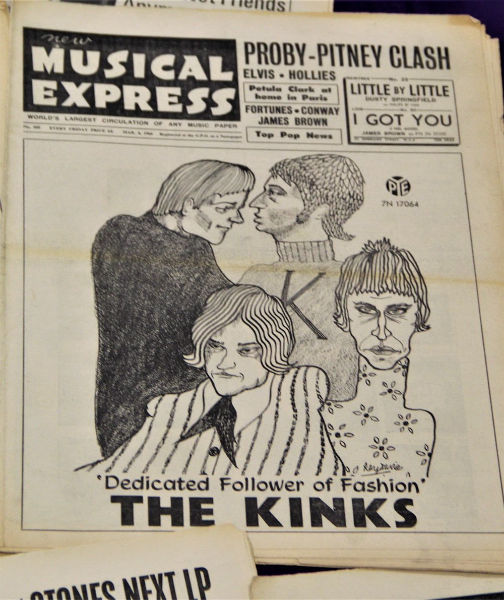 A lot of fifteen copies of the New Musical Express newspapers , these ...