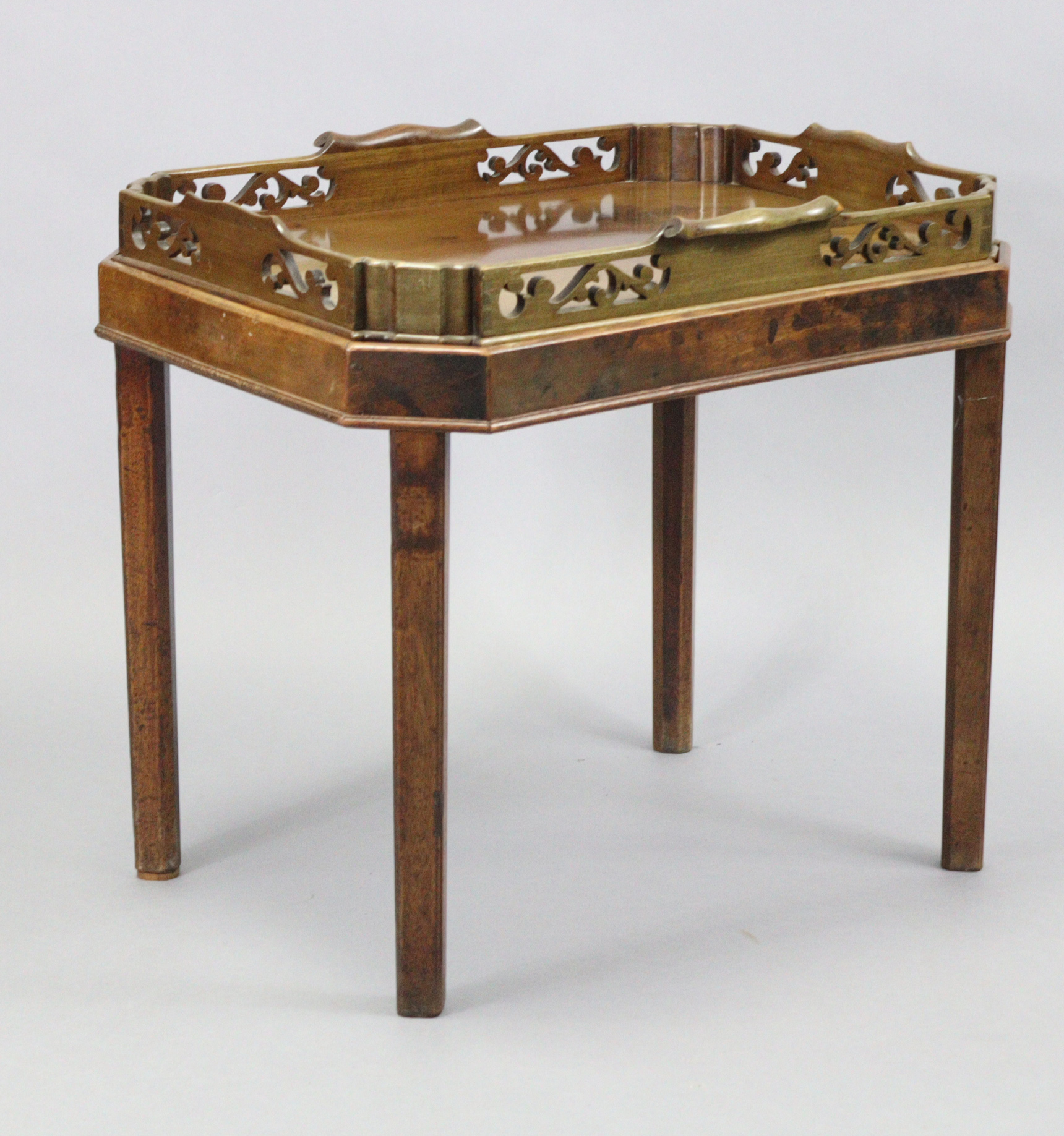 A 19th century walnut rectangular occasional table with canted corners ...