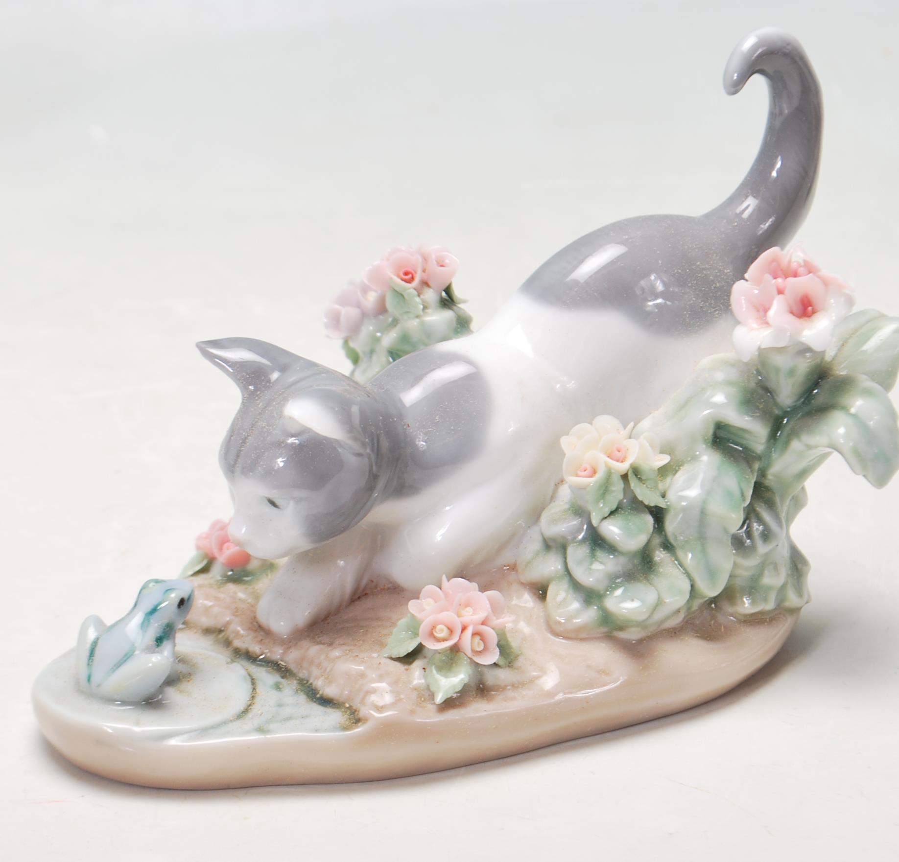 A collection of Lladro cat figurines, to include figures of kittens ...