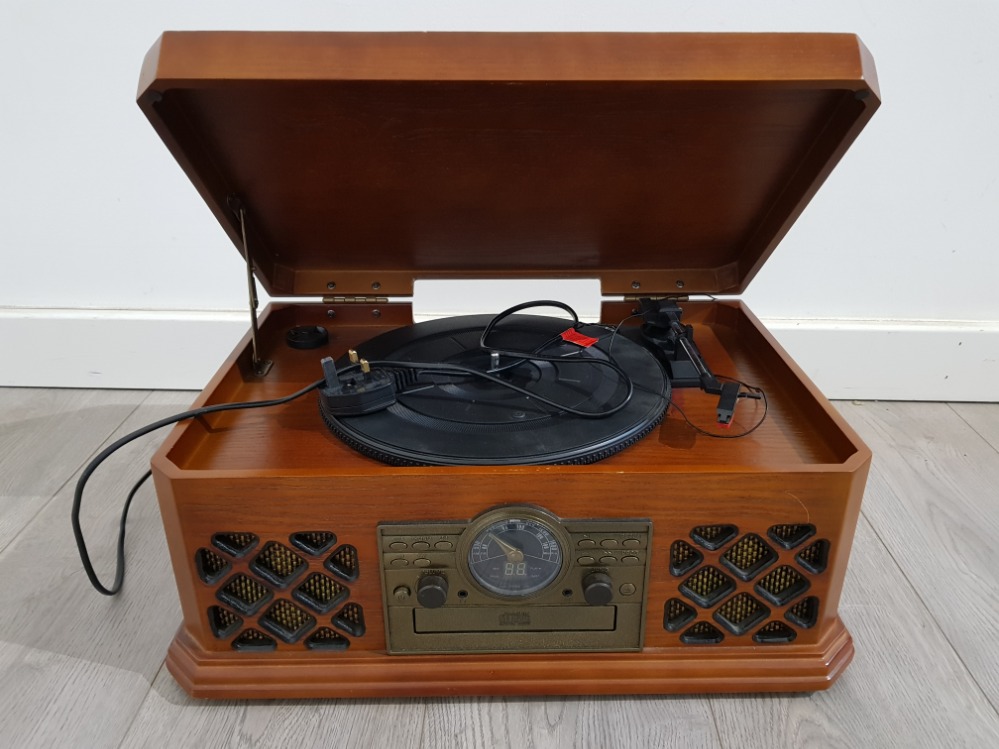 A Zennox electric record player with built in cd and cassette player ...