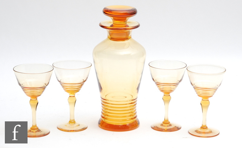 A Stuart and Sons 1930s amber glass cocktail set comprised of a ...