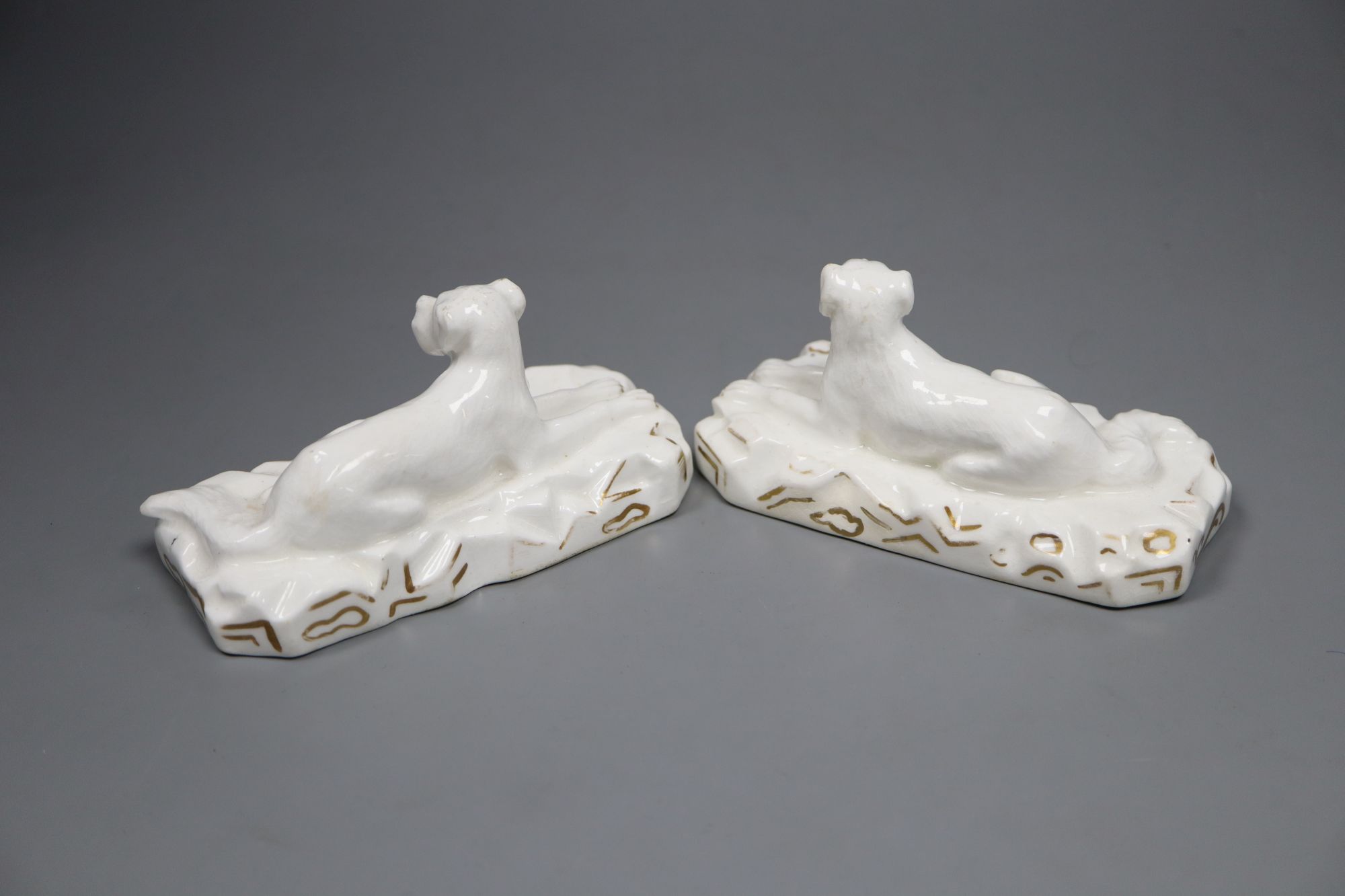 A pair of Grainger, Lee & Co. Worcester porcelain models of recumbent ...