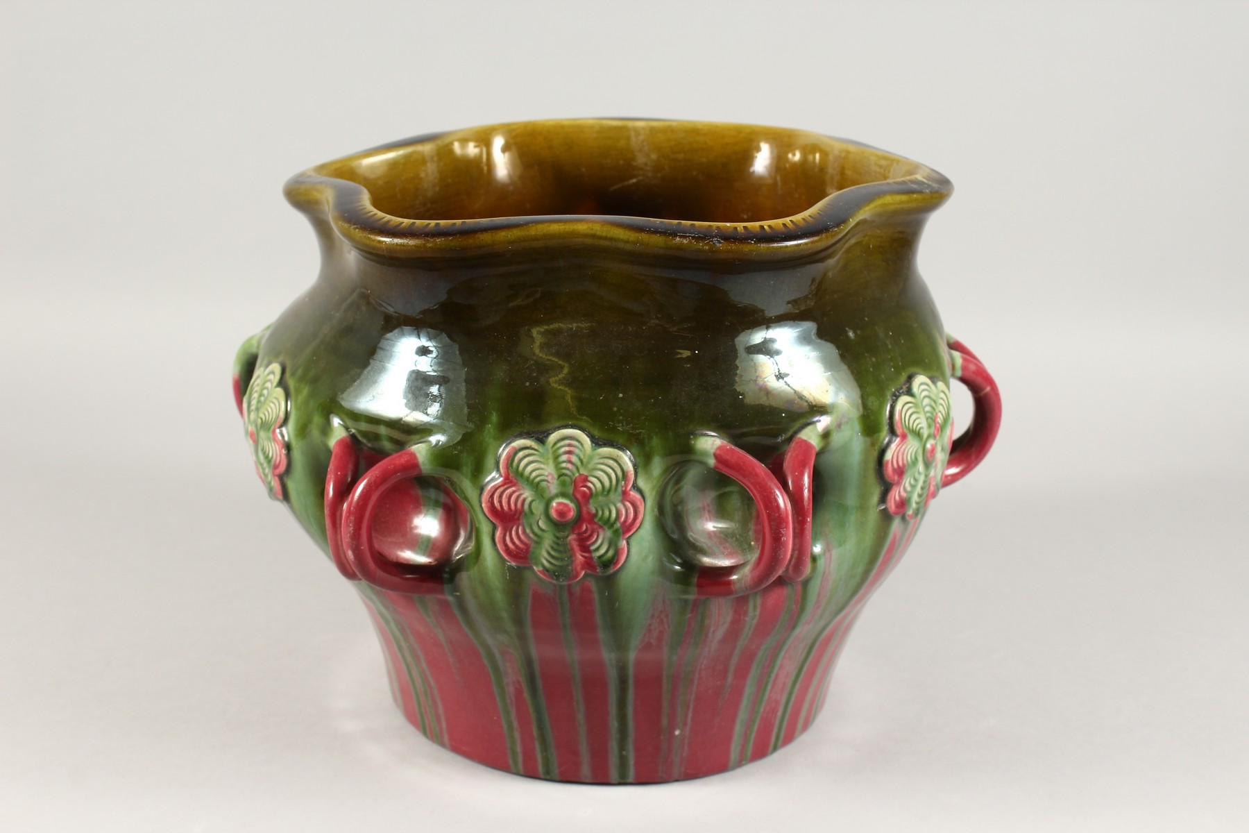A CHRISTOPHER DRESSER LINTHORPE POTTERY JARDINIERE, the sides with six ...