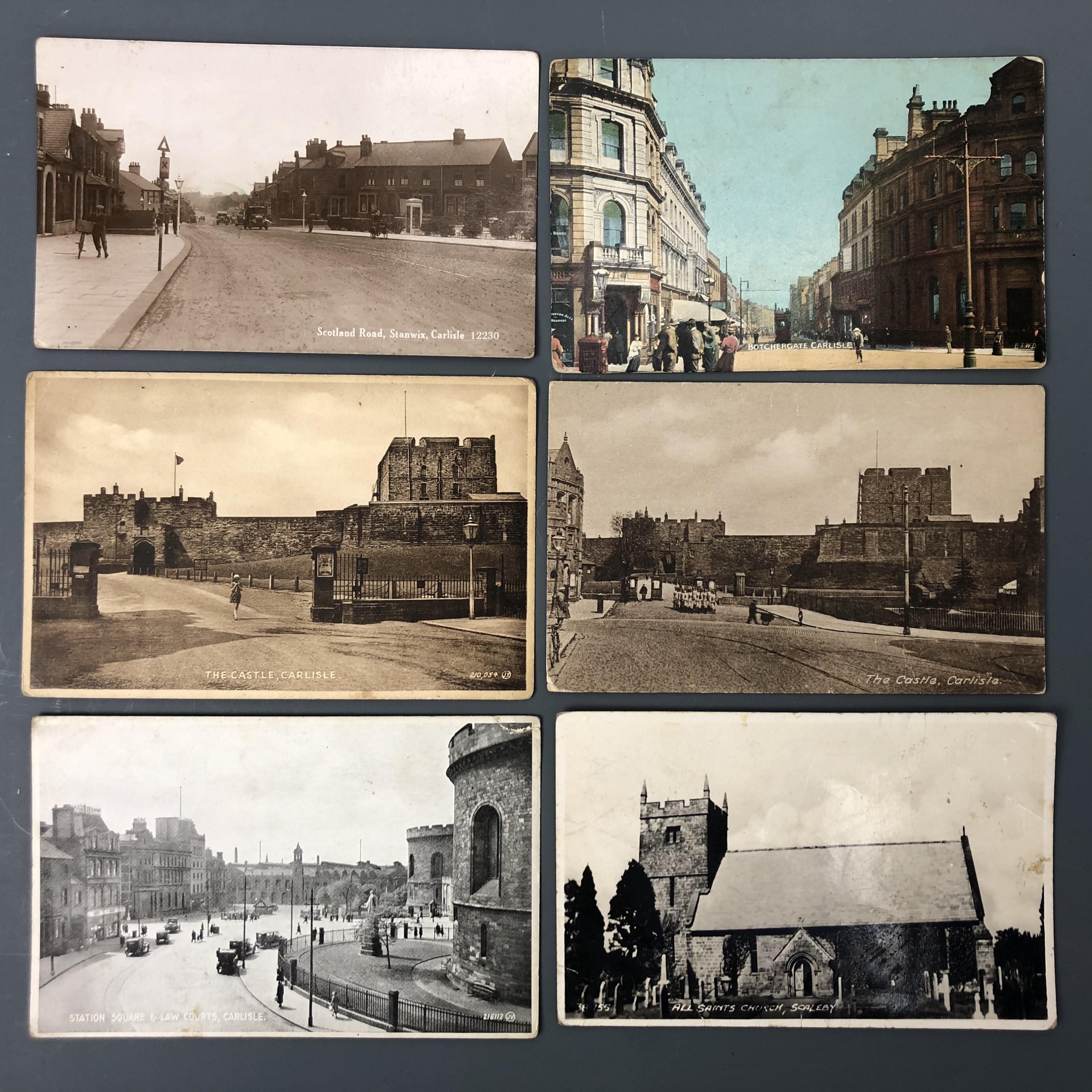 A small group of vintage postcards including photographic views of ...