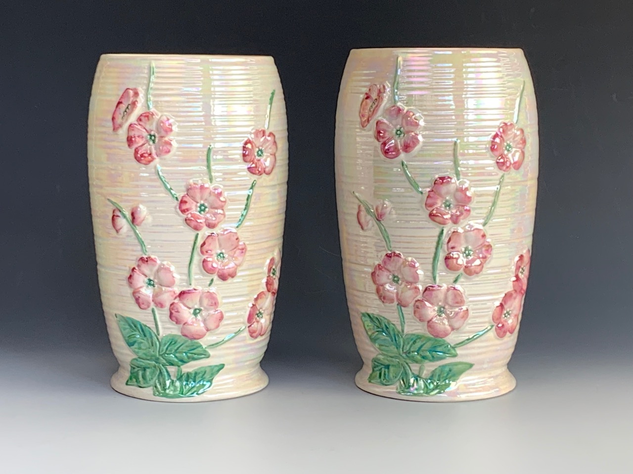 A pair of Maling lustre vases, each decorated with cherry blossom, 21 cm