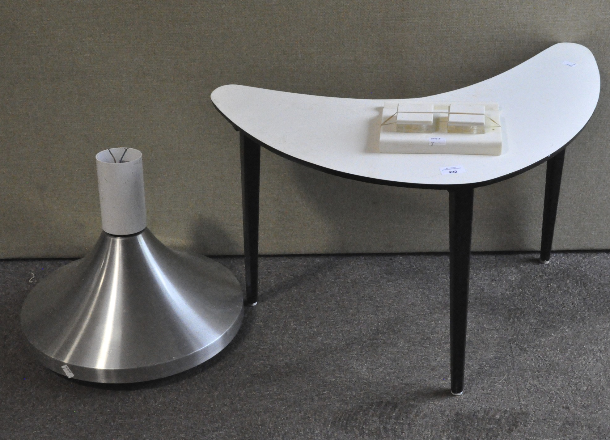 A retro boomerang occasional table, mid-20th century, with white ...