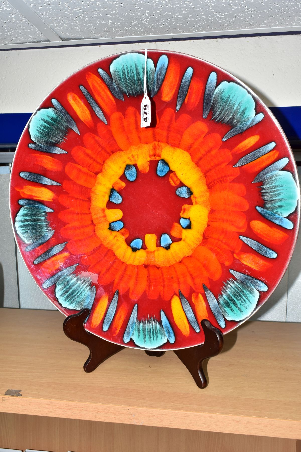 A POOLE STUDIO POTTERY LIVING GLAZE 'VOLCANO' CHARGER, diameter 21cm