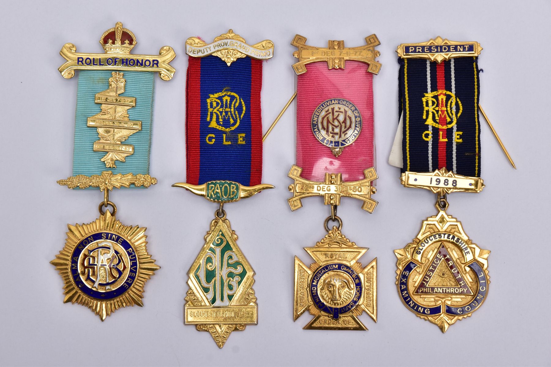 FOUR SILVER GILT, MASONIC MEDALS, of various designs decorated with ...