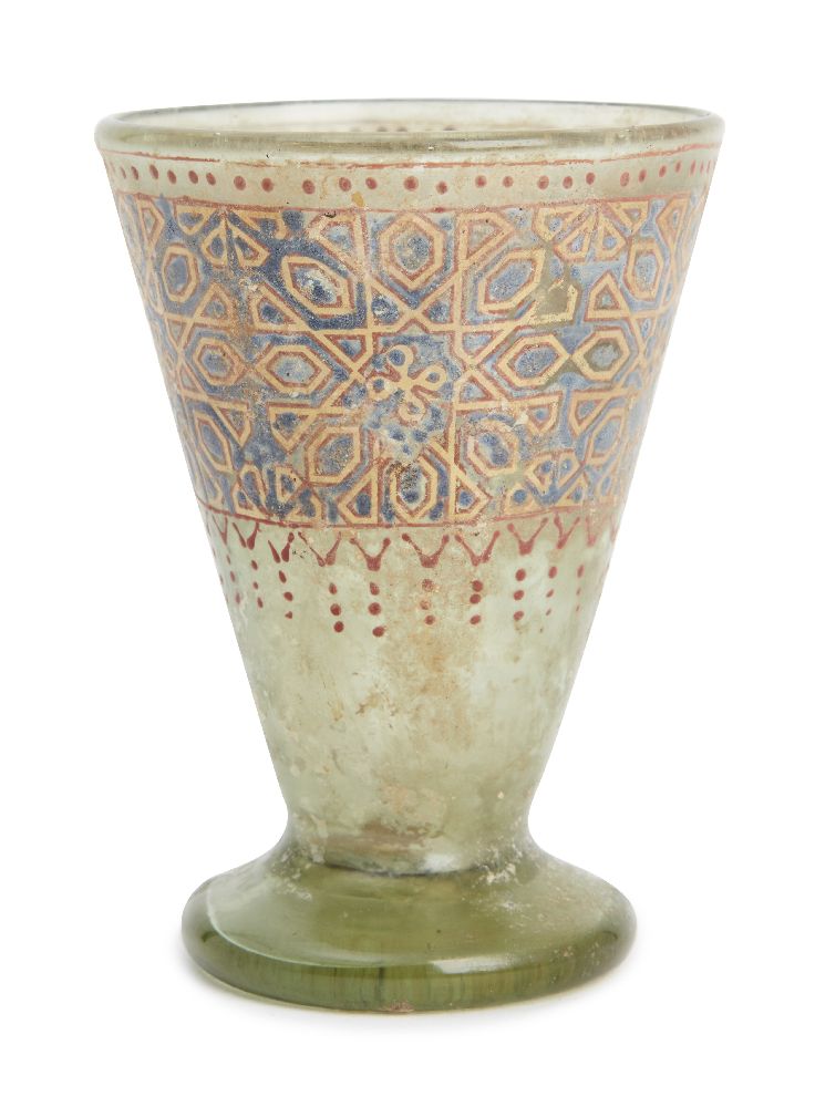 A Mamluk-style gilded and enamelled glass footed cup with geometric ...
