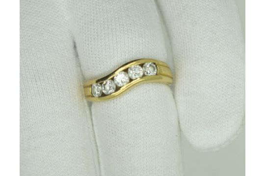 A Modern Five Stone Diamond Ring, of shaped design, channel rubover set ...