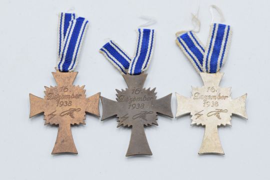 Three German WW2 Third Reich Nazi Mother's Cross Medals comprising gold ...