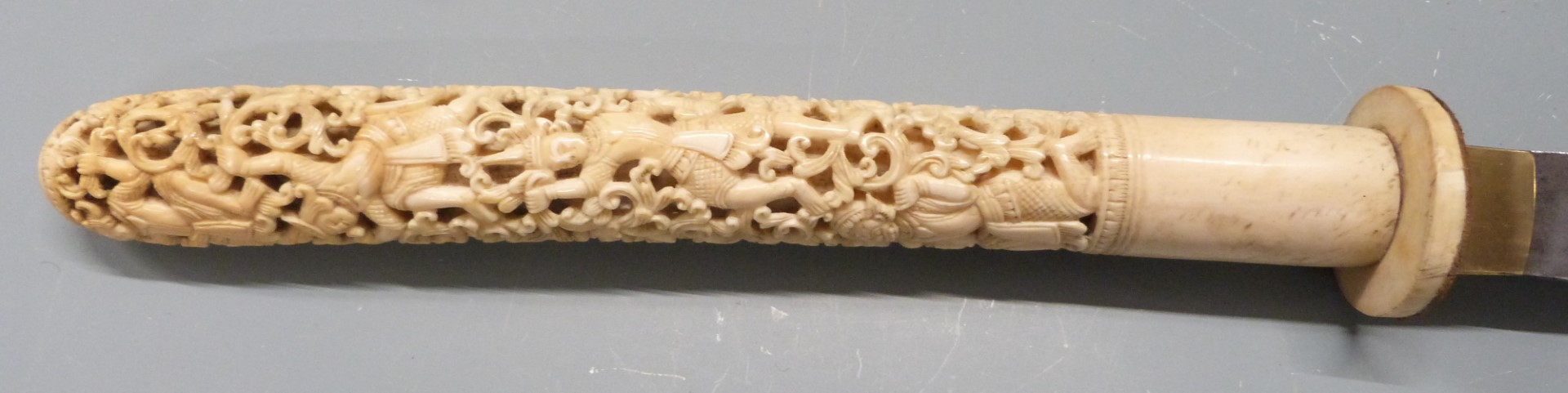 Burmese dha ivory handled sword circa 1900, with ornate carved grip ...