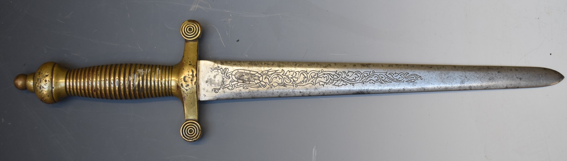 Continental short sword with brass grip and crosspiece, the 31cm blade ...