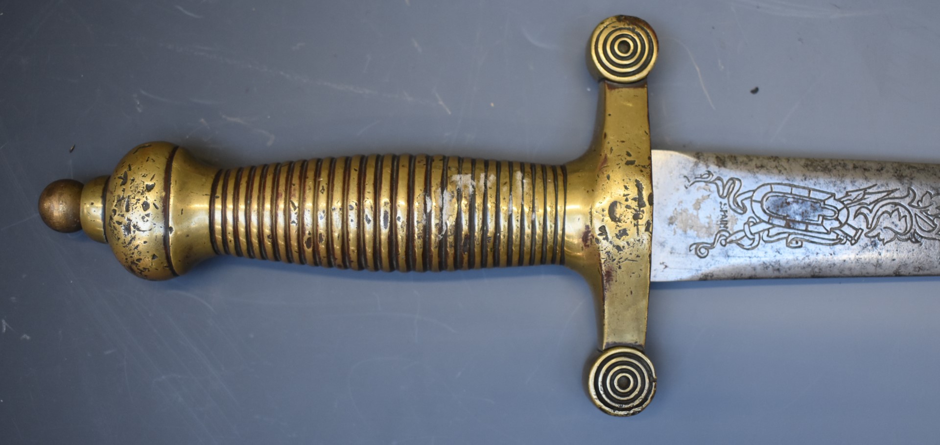 Continental short sword with brass grip and crosspiece, the 31cm blade ...