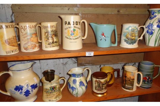 Collection of assorted brewery water jugs and other pottery jugs and mugs