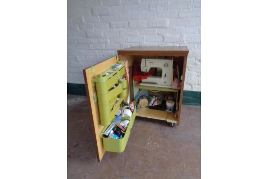 A Bernina minimatic 807 electric sewing machine in cabinet together ...