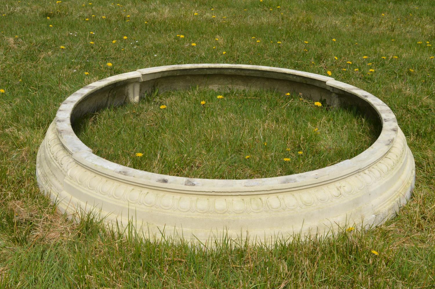 Composite resin and stone circular garden pond surround in four ...
