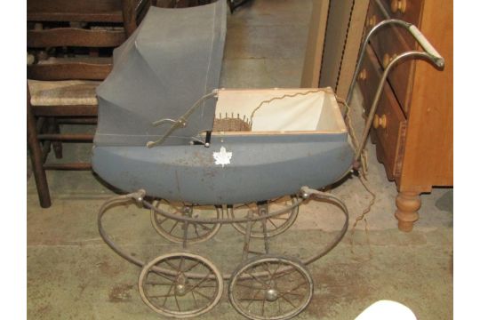 A vintage 'Leeway' pram with sprung frame, wire wheels and hard rubber ...