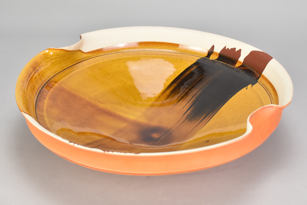 JONNA BEHRENS; a large earthenware dish with altered rim, painted JB ...