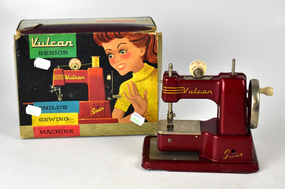 A vintage boxed Vulcan Senior children's sewing machine.