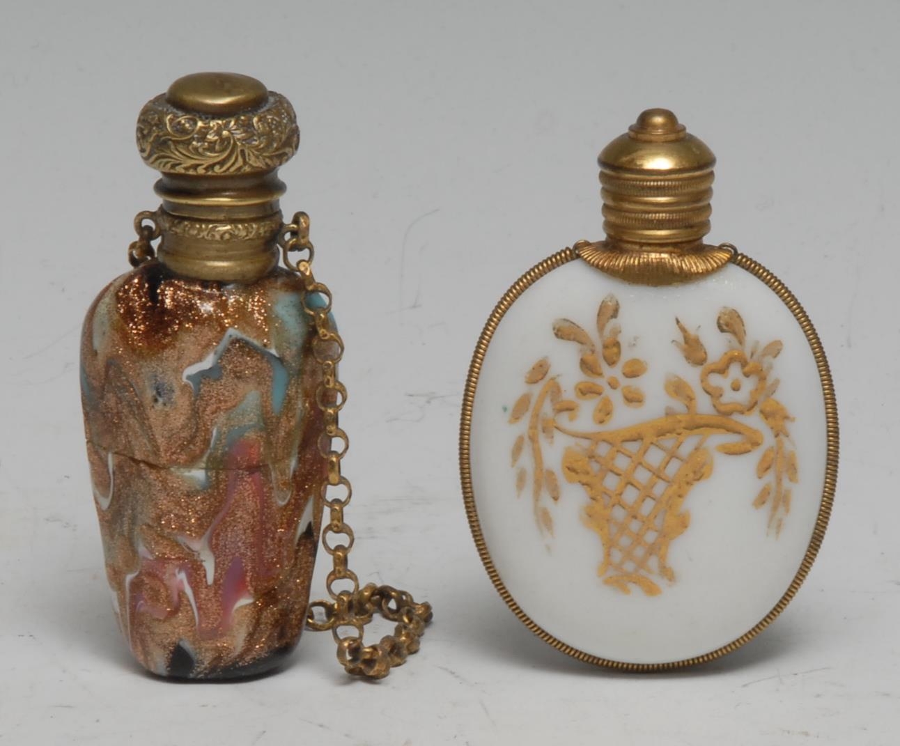 A Rococo Revival gilt-metal mounted opaque glass oval scent bottle ...
