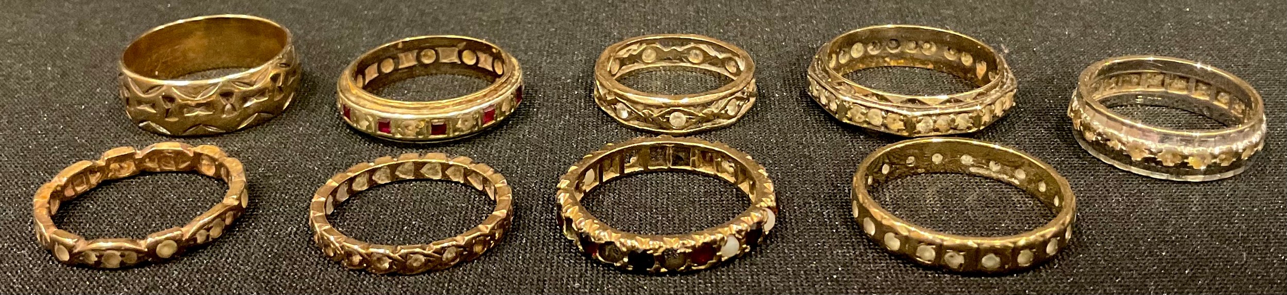 A 9ct gold nonagon eternity ring set with clear stones, size R; other ...