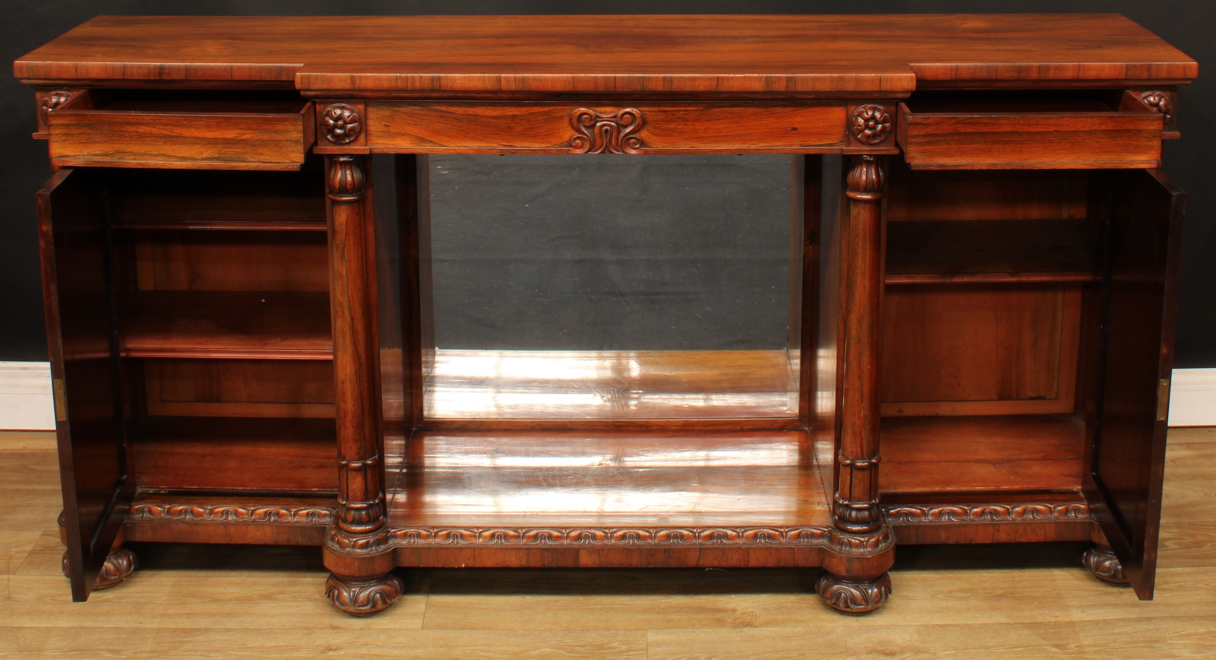 A William IV rosewood break-centre library side cabinet, slightly ...