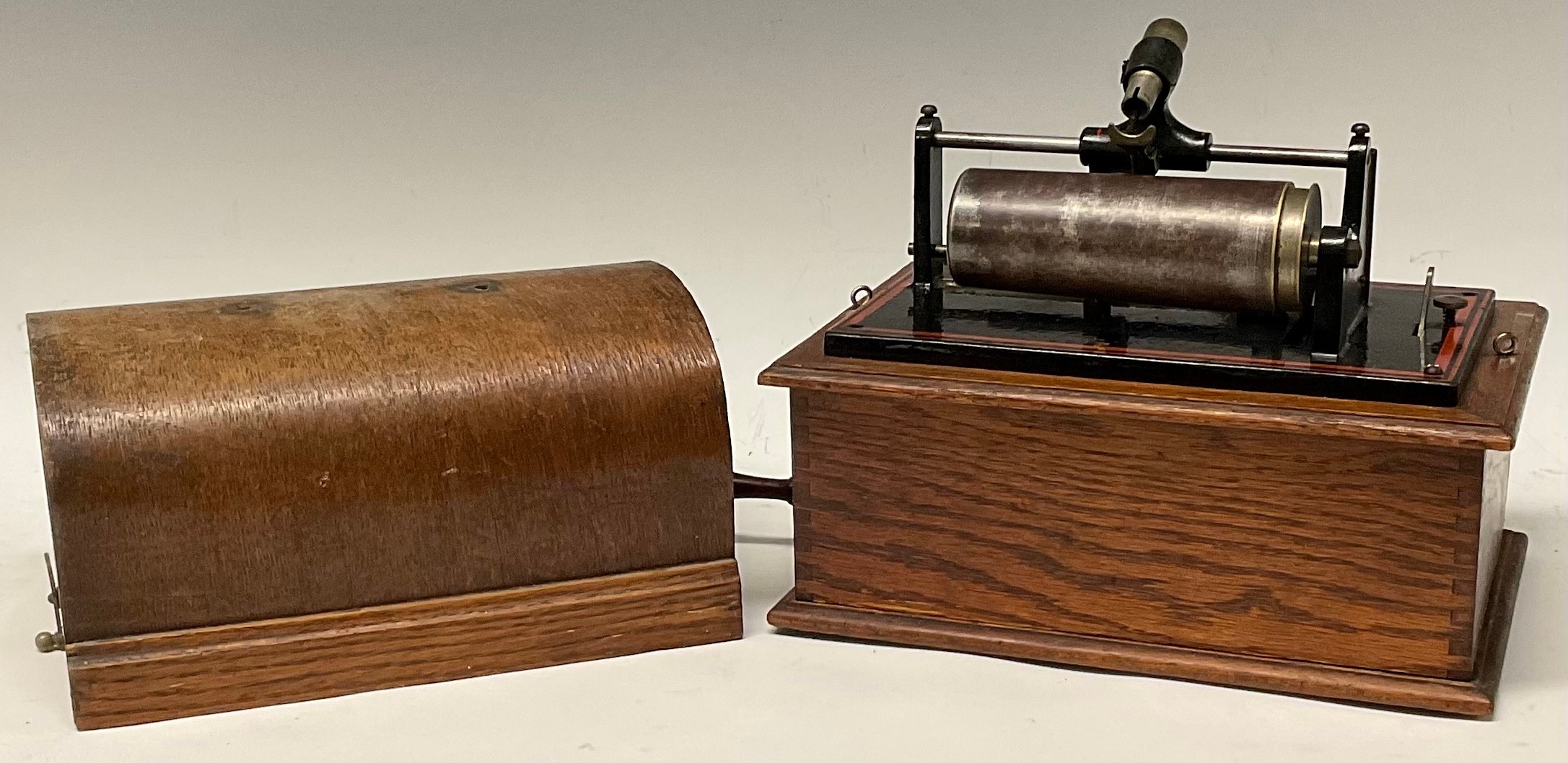 An early 20th century Excelsior EWC phonograph, in black, outlined in ...