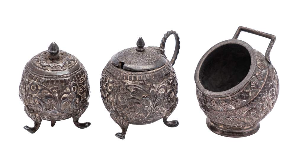 An Indian silver three-piece condiment set: with foliate and scroll ...